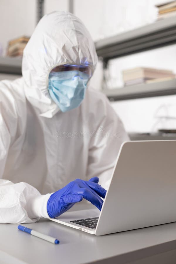 Scientist Working Computer Laptop Looking at Test Tube with Liquid ...