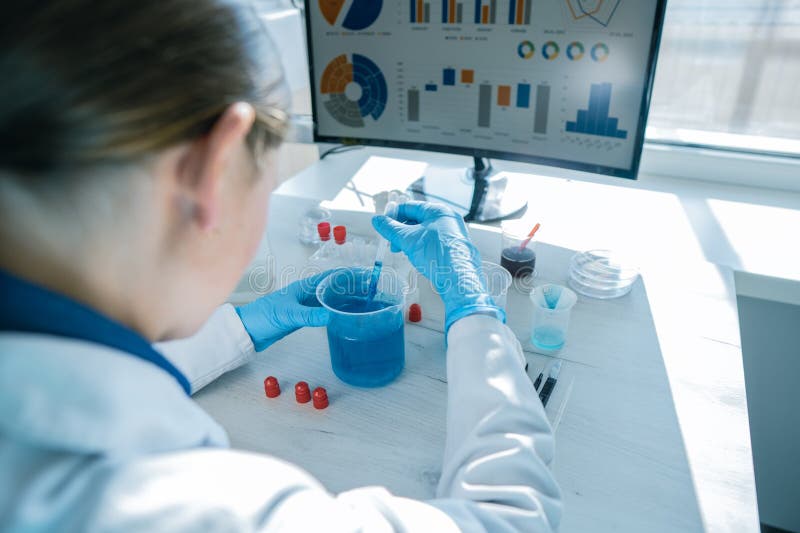 A Scientist Working with Genetic Material in a Biotechnology Laboratory ...