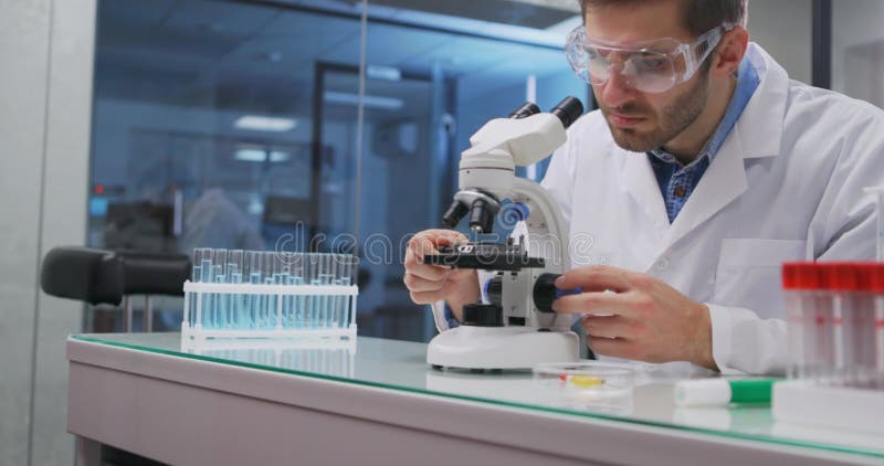 Scientist Working in Lab. Doctor Making Medical Research Using ...