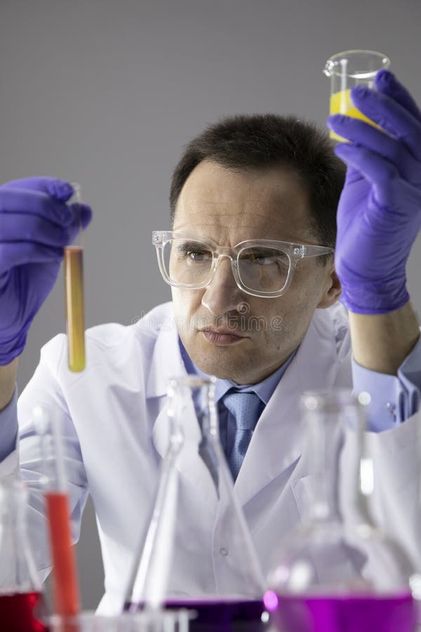 Scientist Working at Lab with Test Tubes Flasks, Performing Science ...