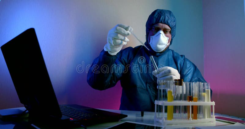 Scientist is Working Alone in Laboratory with Reagents and Medicaments ...