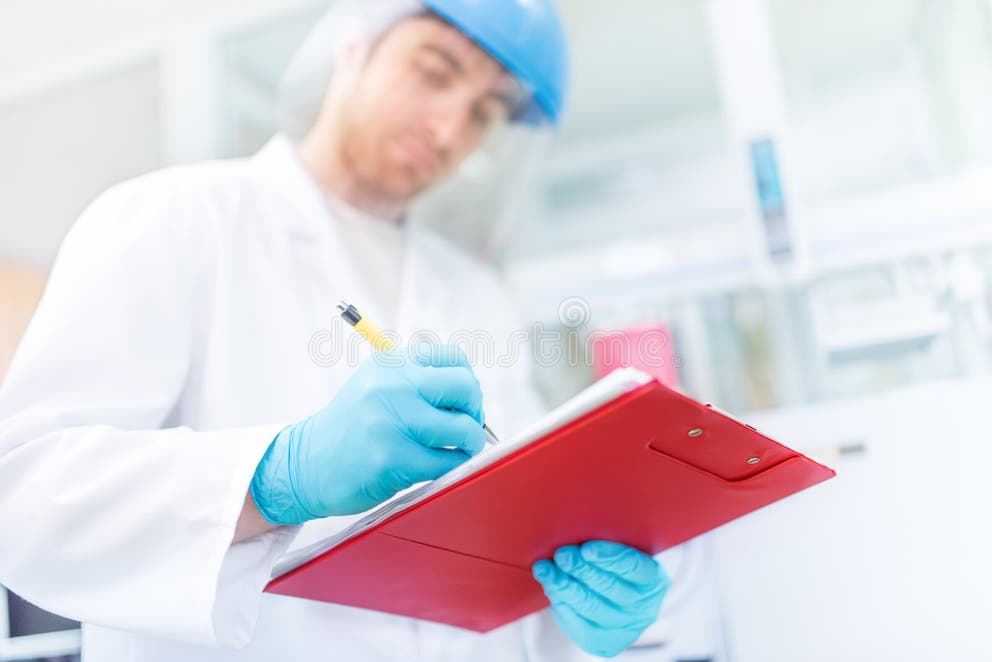 Scientist Working in Laboratory, Writing and Taking Notes on Clipboard ...