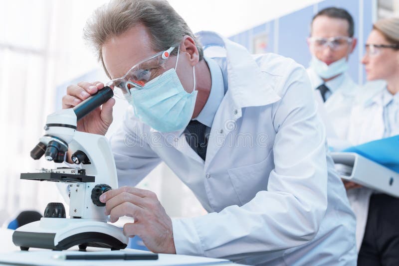 Scientist Working with Microscope Stock Photo - Image of microscope ...