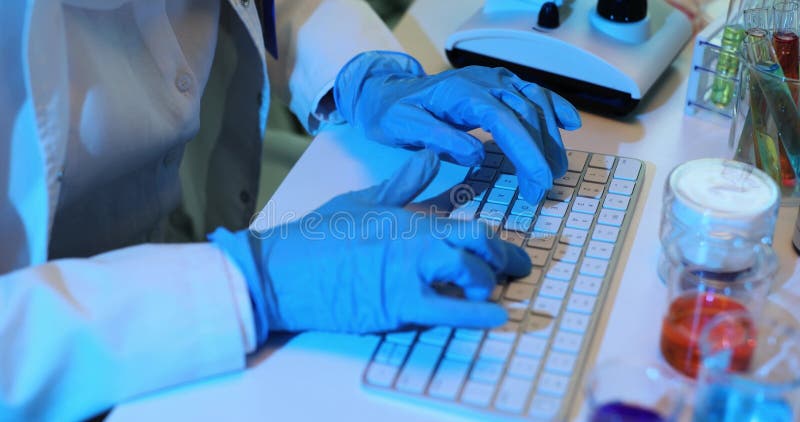 Scientist Works in Laboratory and Types on Computer Keyboard Stock ...
