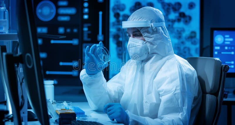 Scientist Works in a Modern Scientific Lab Using Laboratory Equipment ...