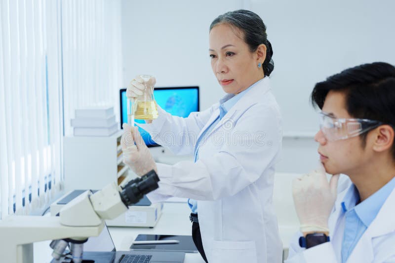 Scientists Analyze Chemical Samples Discuss Technological Innovations ...