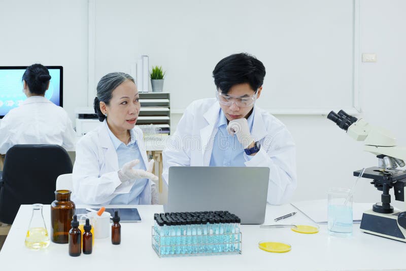 Scientists Analyze Chemical Samples Discuss Technological Innovations ...