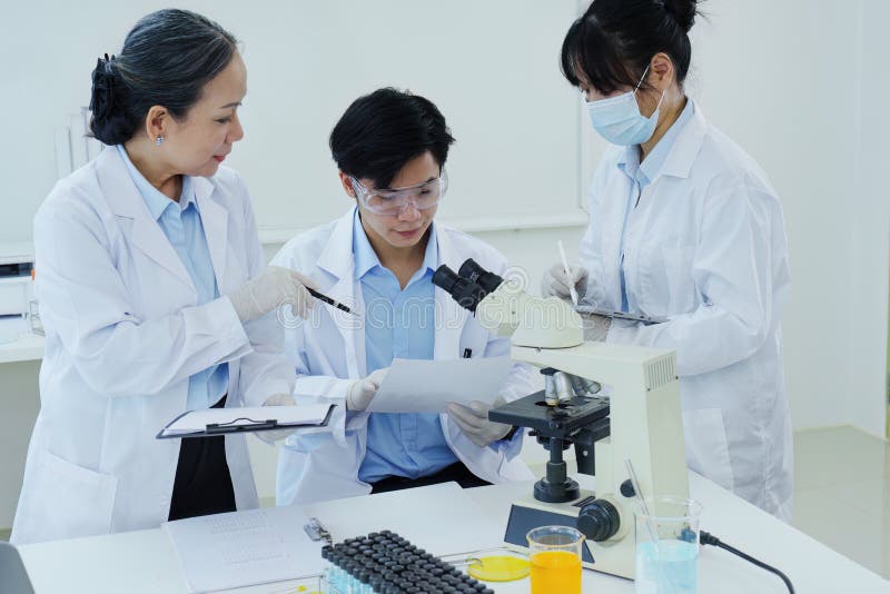 Scientists Analyze Chemical Samples Discuss Technological Innovations ... Scientists Analyze Chemical Samples Discuss Technological Innovations ...