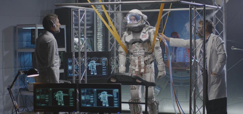 Scientists Attaching Anti-gravity Bands To Astronaut Stock Image ...