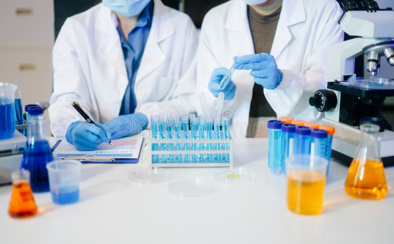 Scientists, Beakers, and Microscopes in Cutting-edge Research. Perfect ...