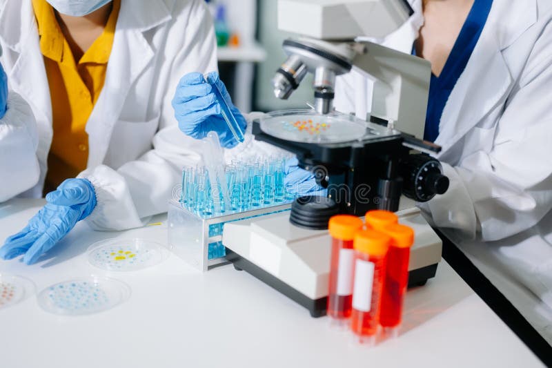 Scientists, Beakers, and Microscopes in Cutting-edge Research. Perfect ...