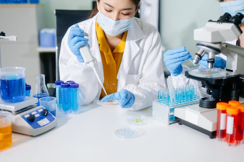 Scientists, Beakers, and Microscopes in Cutting-edge Research. Perfect ...