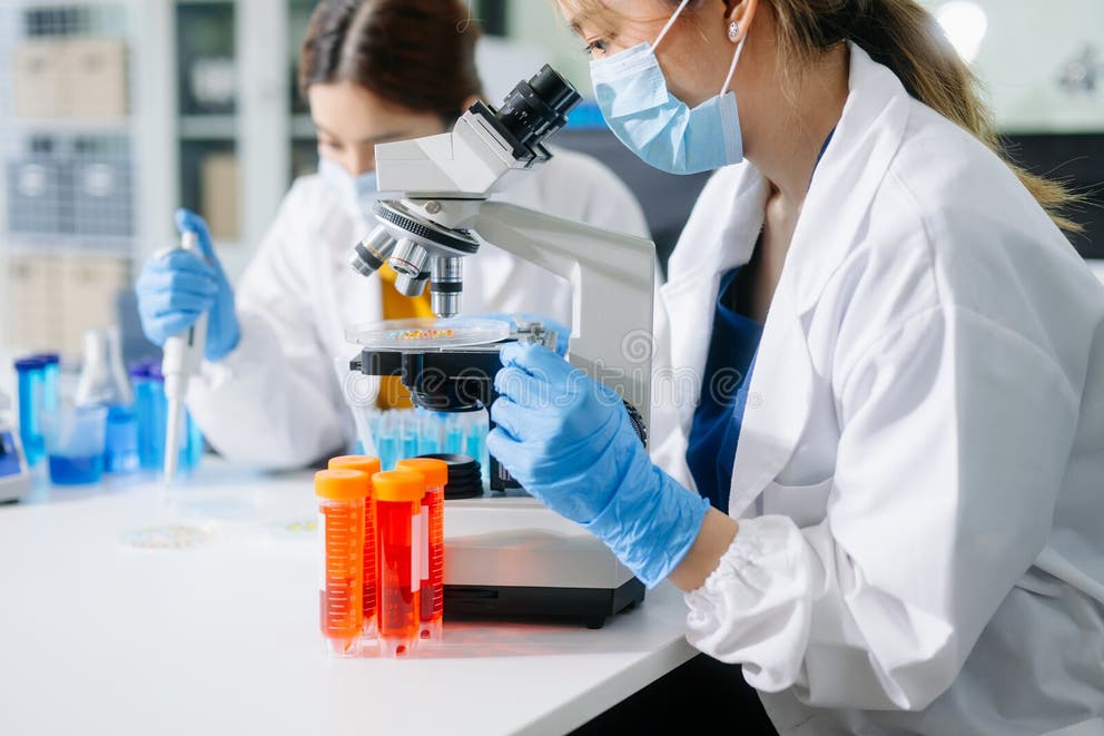 Scientists, Beakers, and Microscopes in Cutting-edge Research. Perfect ...