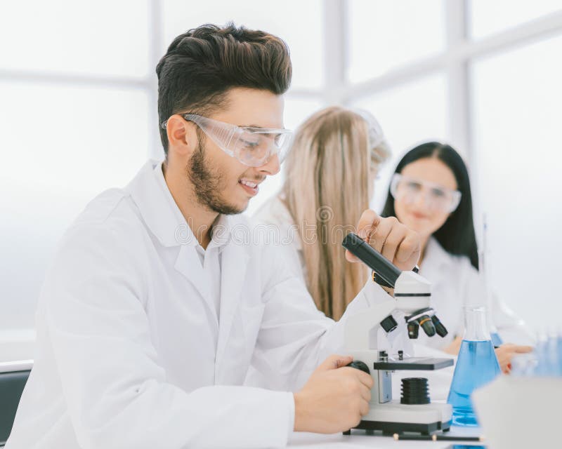 Scientists Biologists Sitting at the Laboratory Table. Stock Photo ...