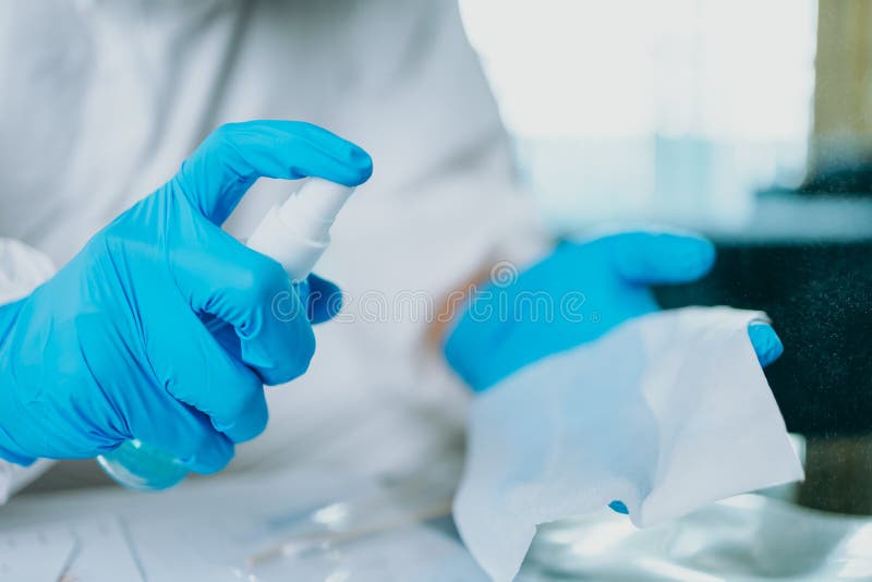 Scientists are Cleaning Labtop by Alcohol and Tissue after Checking and ...