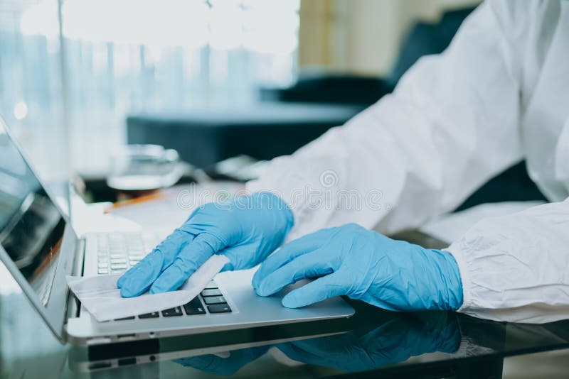 Scientists are Cleaning Labtop by Alcohol and Tissue after Checking and ...