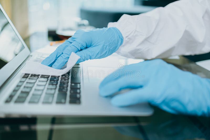 Scientists are Cleaning Labtop by Alcohol and Tissue after Checking and ...