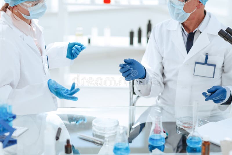 Scientists Colleagues Discussing Something Sitting at the Laboratory ...