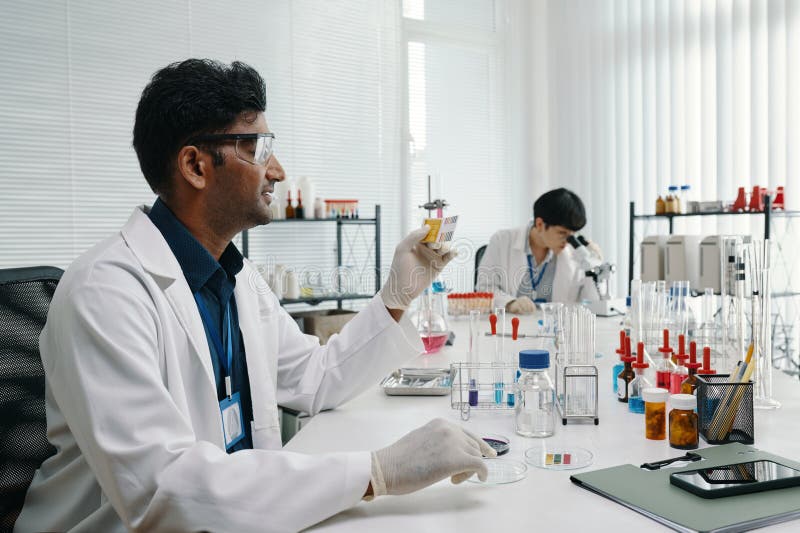 Scientists Conducting Experiments in a Modern Laboratory Stock Image ...