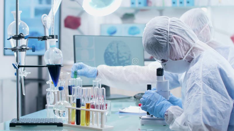 Scientists in Coverall Making Some Experiments Stock Footage - Video of ...