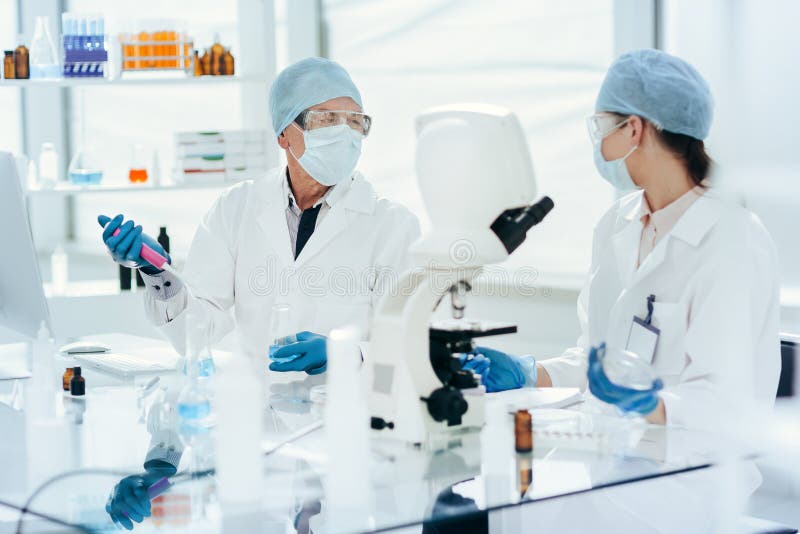 Scientists Discussing Information about the Spread of the Coronavirus ...