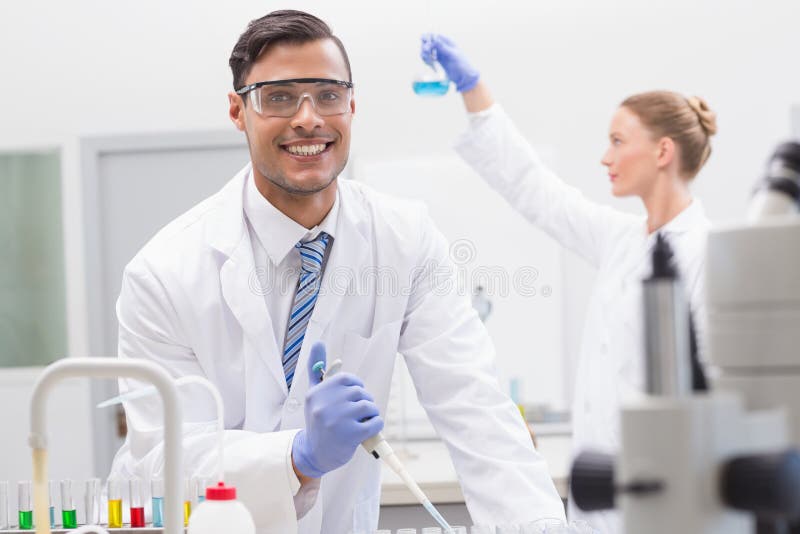 Scientists Examining Tubes and Baker Stock Photo - Image of partners ...