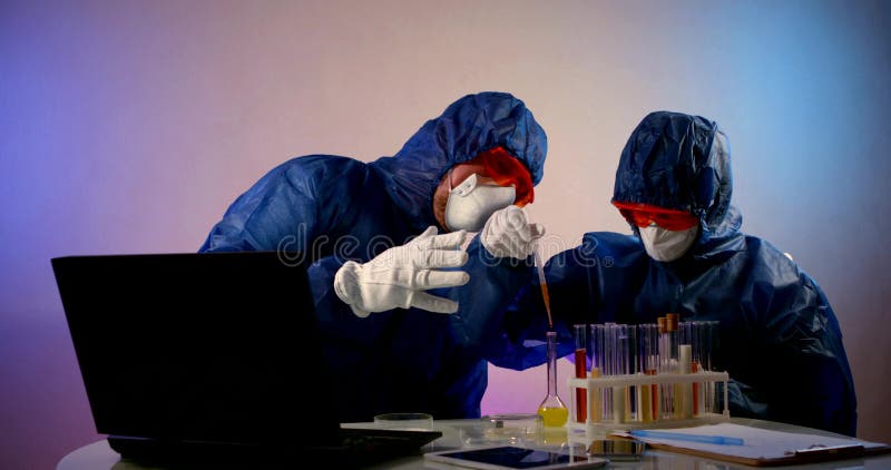 Scientists are Exploring Virus in Laboratory, Viewing Test Vial, Two ...