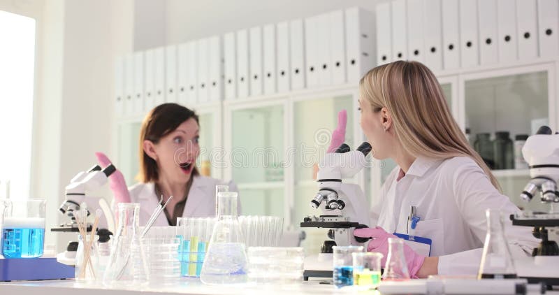 Scientists Give High-five in Laboratory with Microscopes Stock Video ...