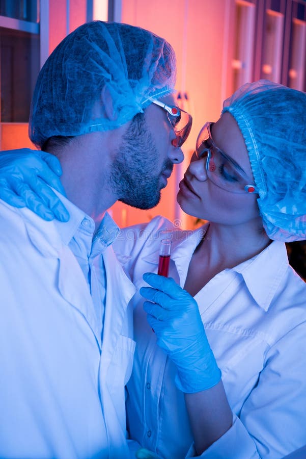 Scientists Having Office Romance at Laboratory Stock Photo - Image of ...