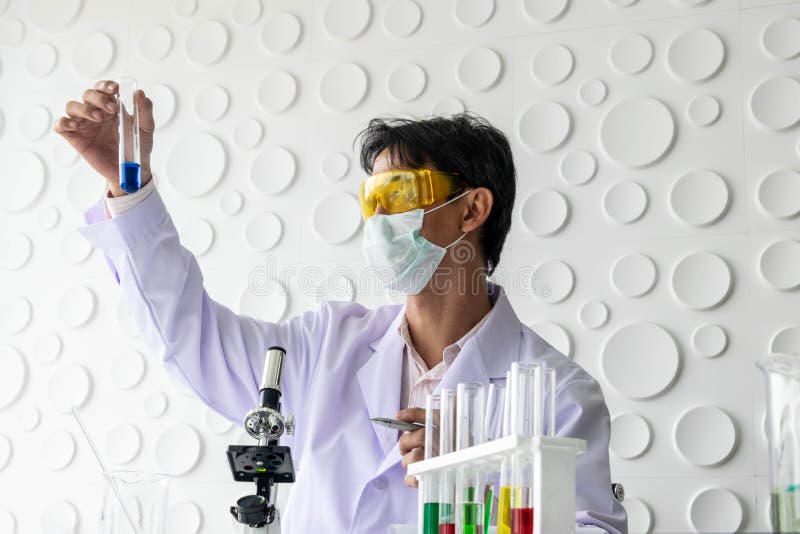 Scientist holding beaker stock image. Image of woman - 17241465