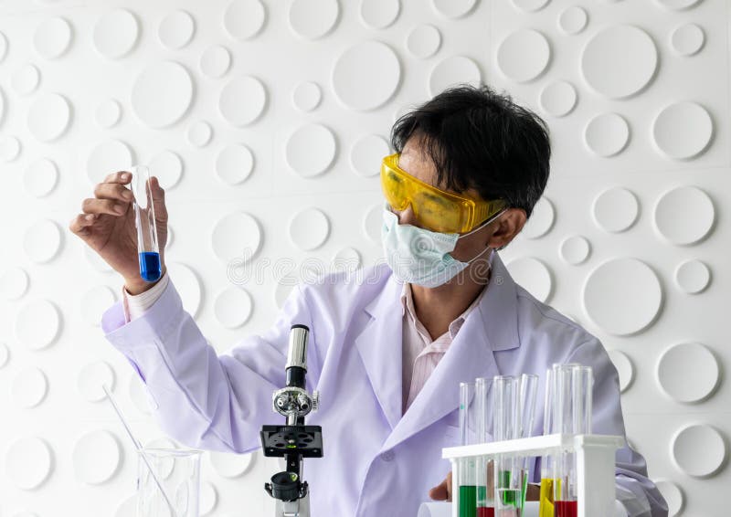 Scientists Holding a Beaker. Stock Photo - Image of chemistry ...