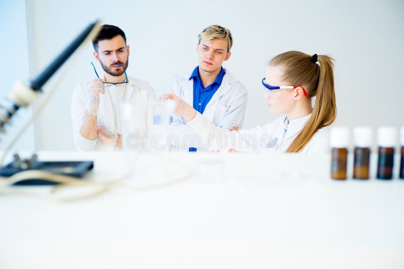 Scientists at laboratory stock photo. Image of group - 92608046
