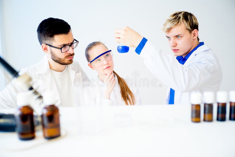 Scientists at laboratory stock image. Image of discovery - 92608281