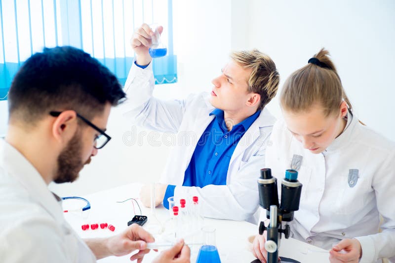 Scientists at laboratory stock image. Image of chemist - 92813061