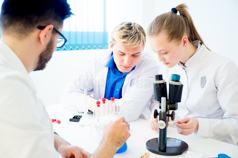 Scientists at laboratory stock image. Image of education - 92813187