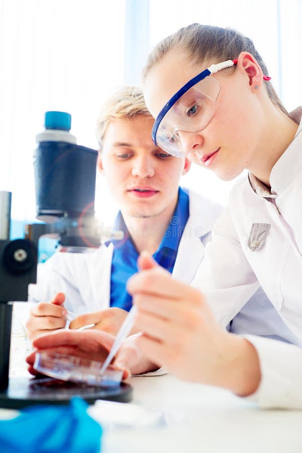 Scientists at laboratory stock image. Image of laboratory - 92882953