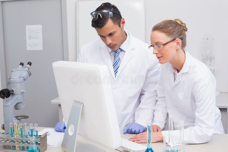 Scientists Looking at Computer Stock Image - Image of gloves, caucasian ...