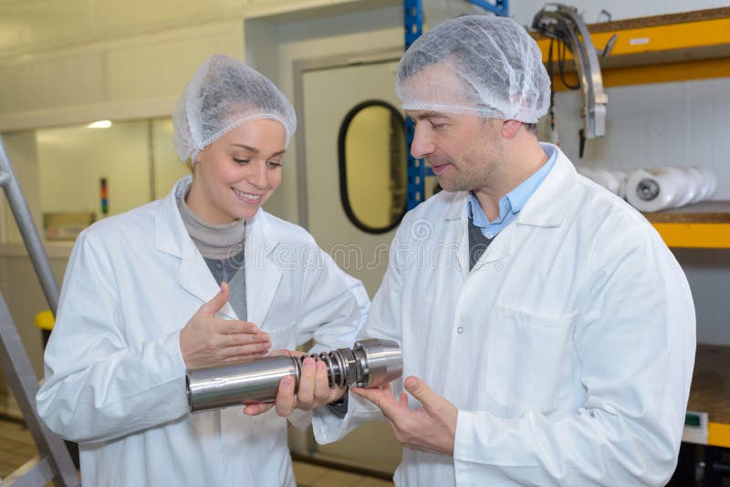 Scientists Looking Iron Device Together at Lab Stock Photo - Image of ...