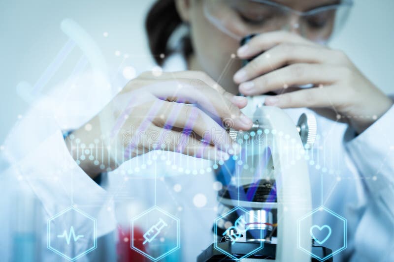 Scientists Looking at Samples Under a Microscope this Image is a ...