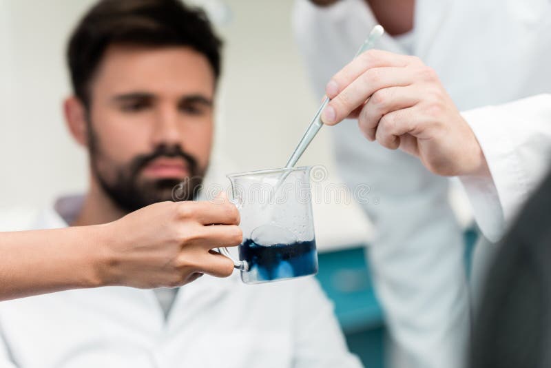 Scientists Making Experiment with Reagent and Pipette Stock Photo ...