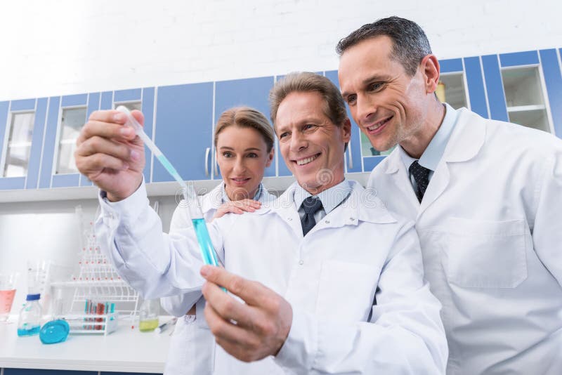 Scientists Making Experiment with Sample Stock Image - Image of pipette ...