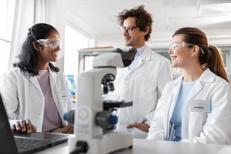 Scientists with Microscope Working in Laboratory Stock Image - Image of ...