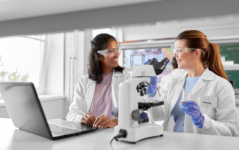 Scientists with Microscopes Working in Laboratory Stock Image - Image ...