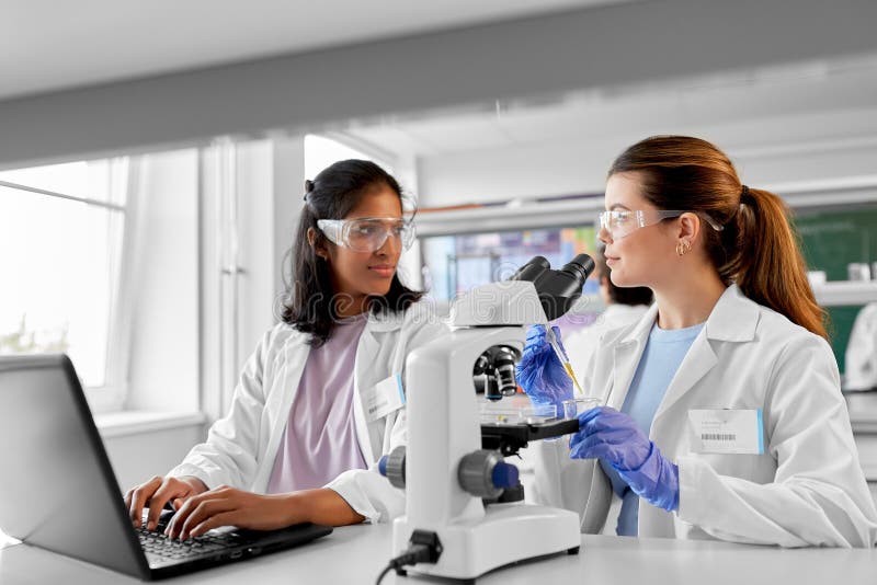 Scientists with Microscopes Working in Laboratory Stock Image - Image ...