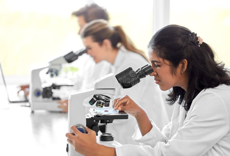 Scientists with Microscopes Working in Laboratory Stock Photo - Image ...