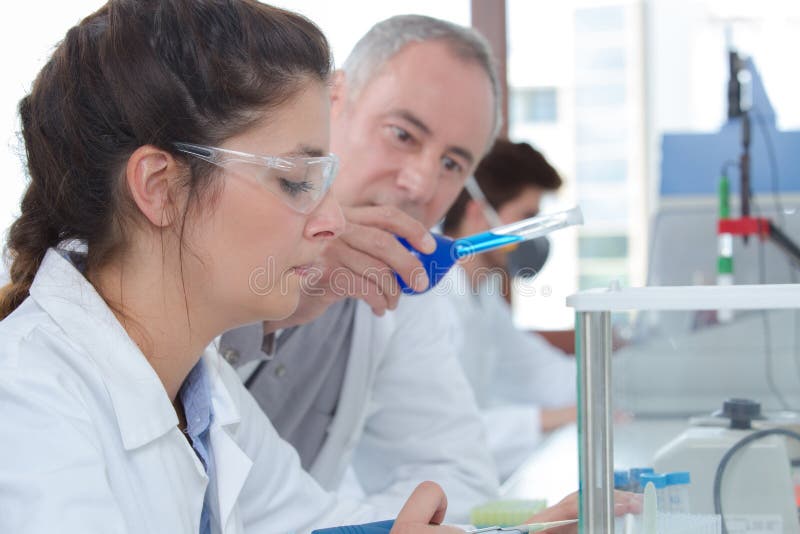 Scientists Performing Experiment in Laboratory Stock Image - Image of ...