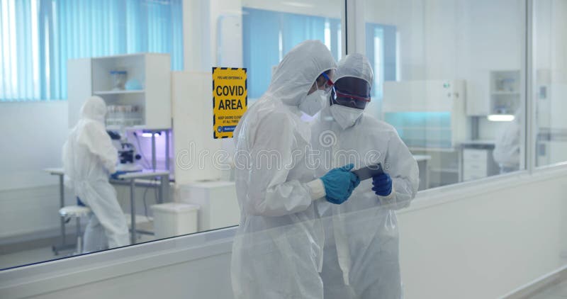 Scientists in Ppe Suit during Coronavirus Outbreak Working in ...