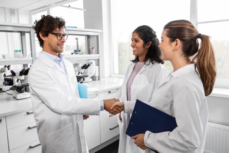 Scientists Shaking Hands in Laboratory Stock Image - Image of agreement ...