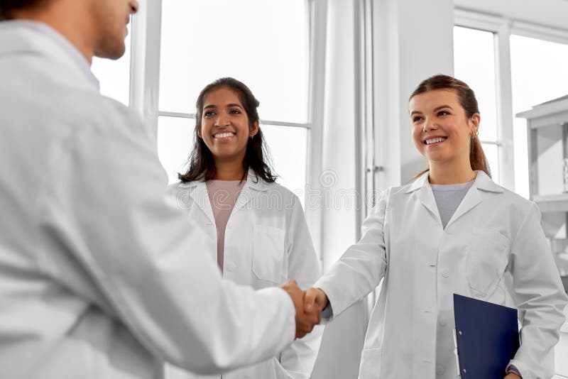 Scientists Shaking Hands in Laboratory Stock Image - Image of agreement ...