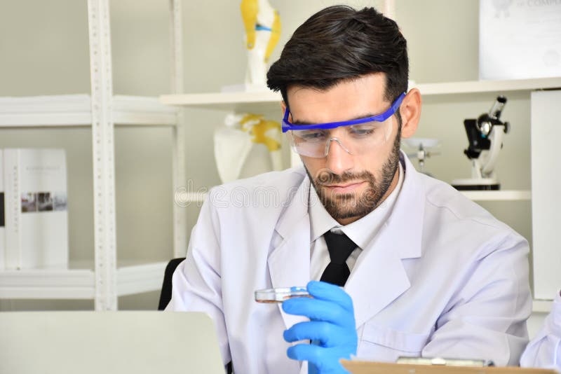 Scientists Show Test Tubes that are Satisfactory. Scientists Have ...